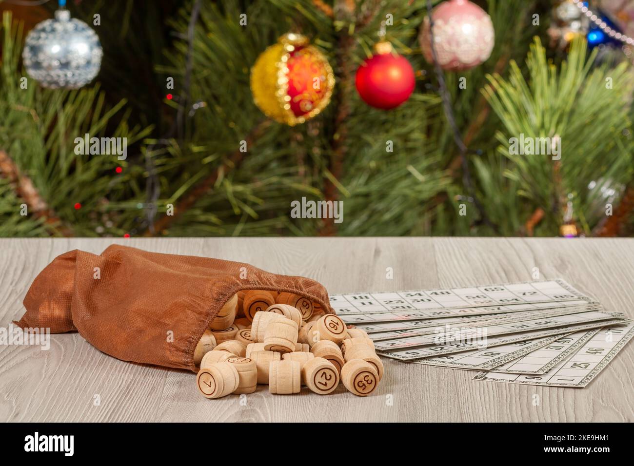 Board game lotto. Stacked wooden lotto barrels with bag and game cards ...