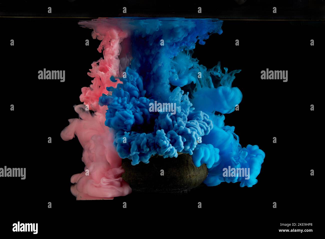 Abstract acrylic paint color swirls in water, black background ...