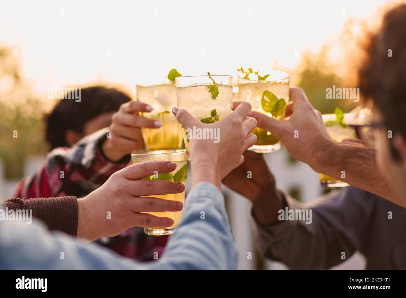 Happy Multiethnic Friends Having Fun Cheering With Cocktails At