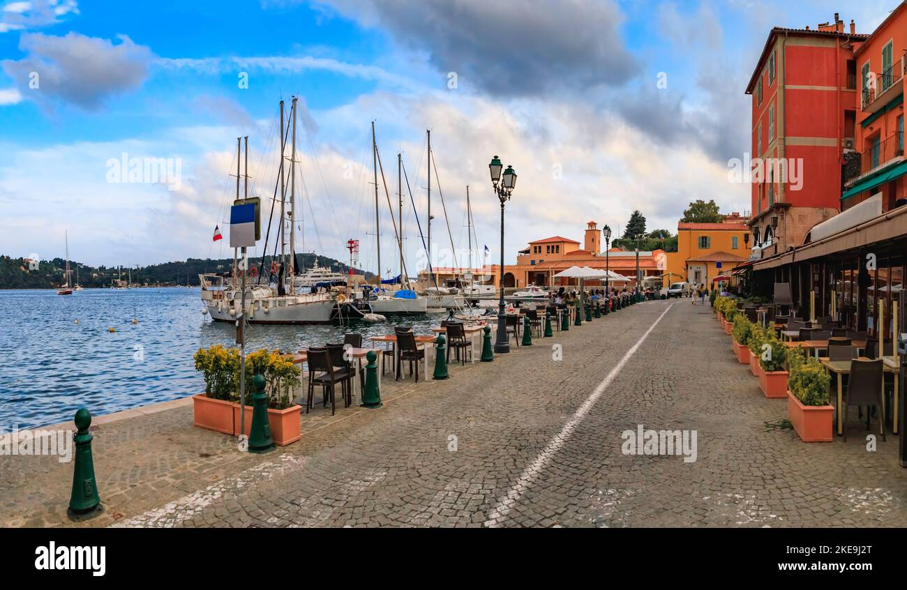 Seaside promenade with colorful traditional houses along the ...