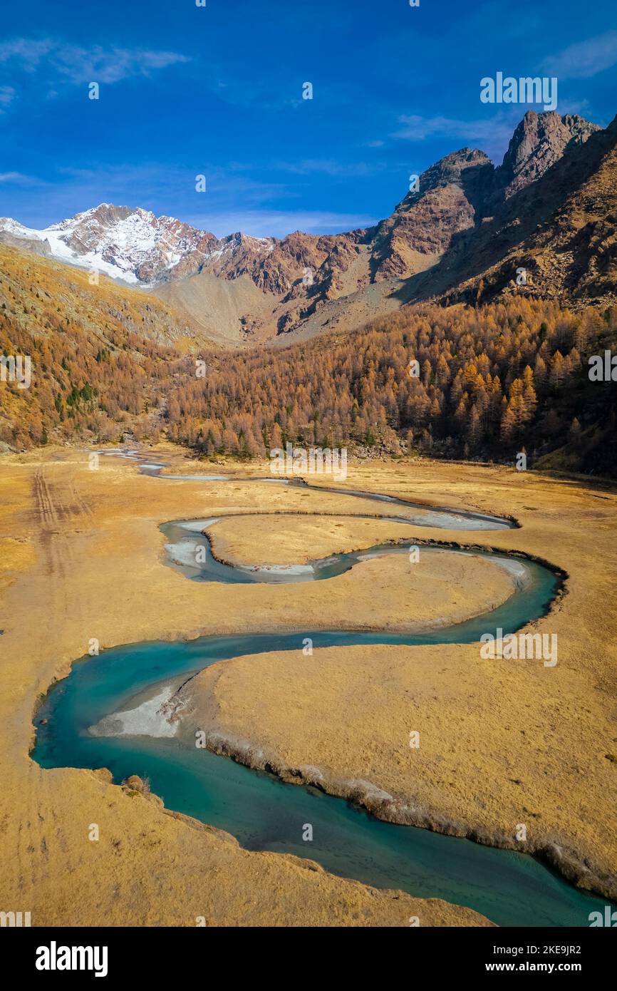 Aerial view of Preda Rossa valley in autumn in front of Monte Disgrazia ...