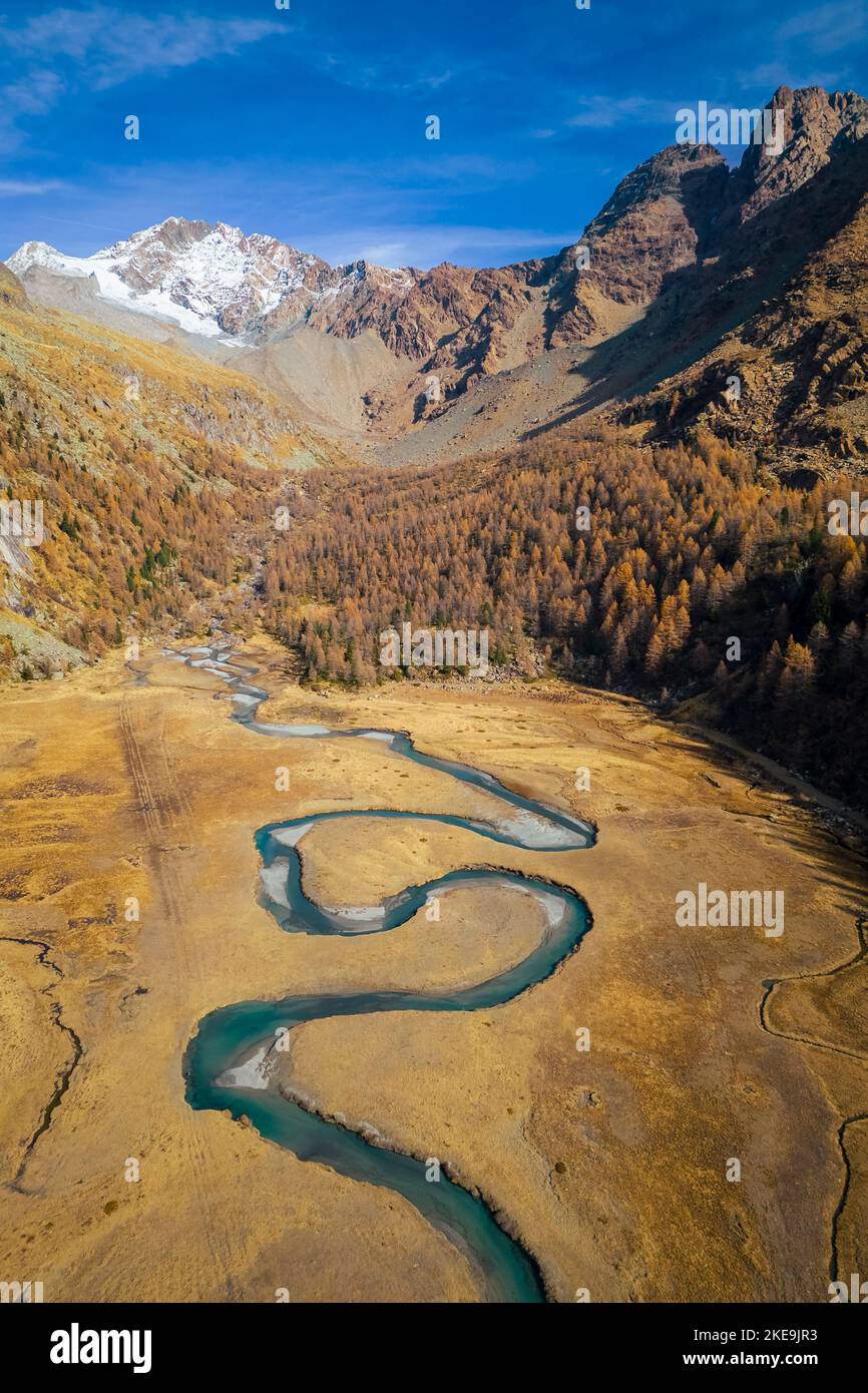 Aerial view of the winding Duino river in autumn in Preda Rossa valley ...