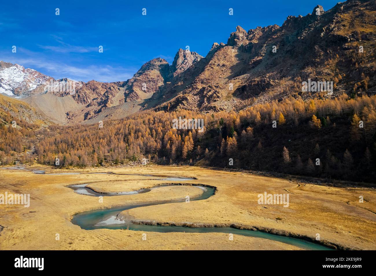 Aerial view of Preda Rossa valley in autumn in front of Monte Disgrazia ...