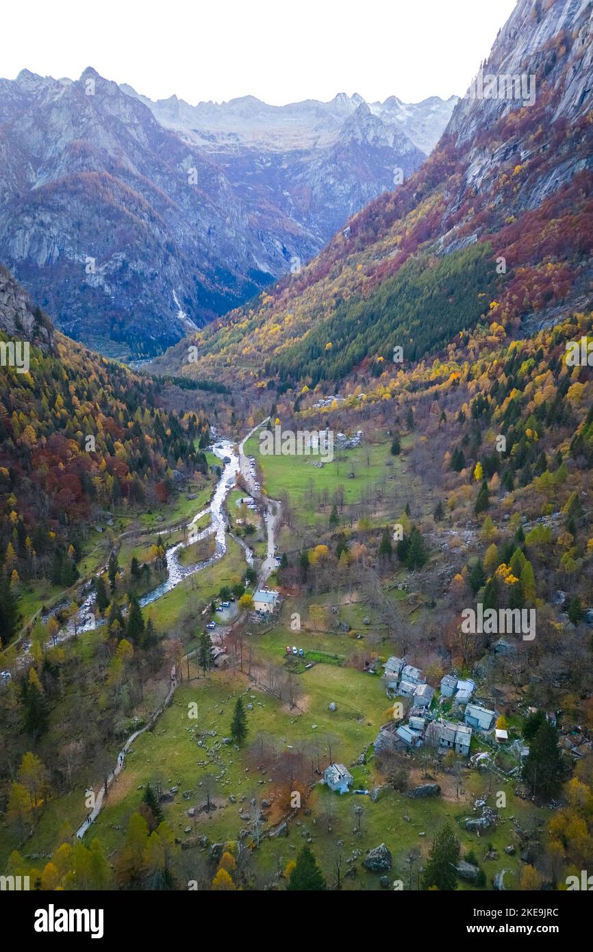 Aerial view of the Val di Mello river and valley at sunset in autumn ...