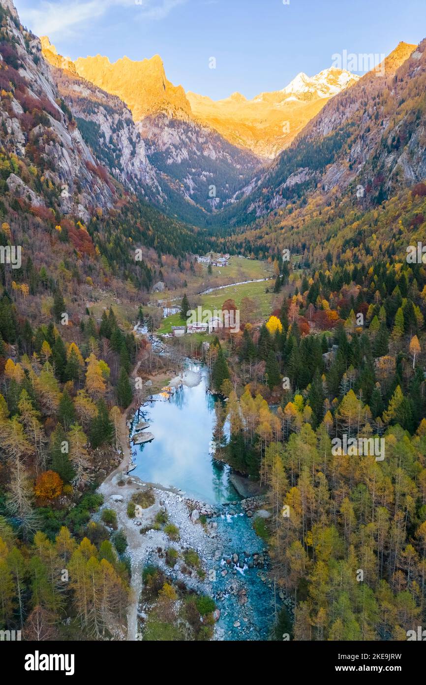 Aerial view of the Val di Mello river and valley at sunset in autumn ...