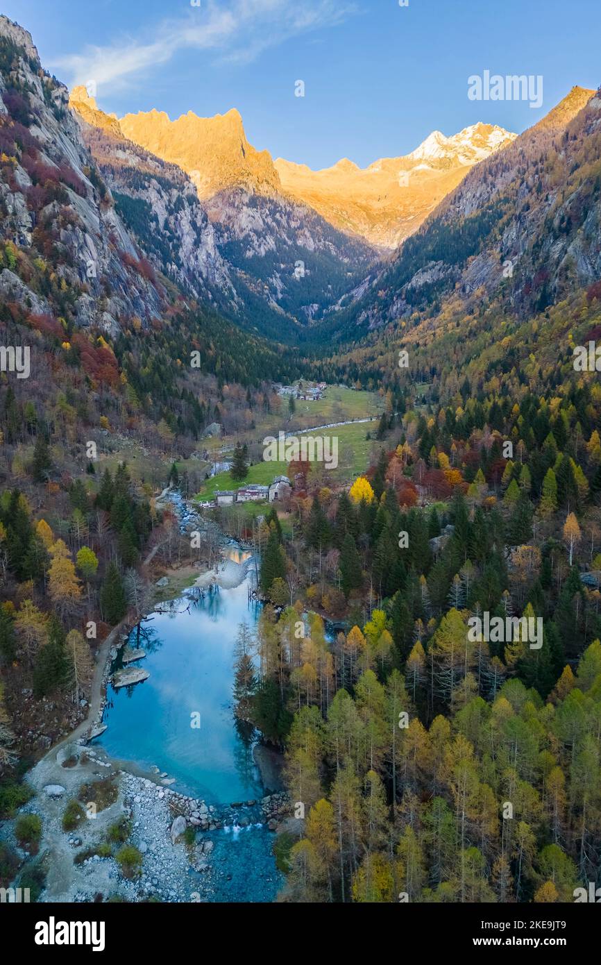 Aerial view of the Val di Mello river and valley at sunset in autumn ...