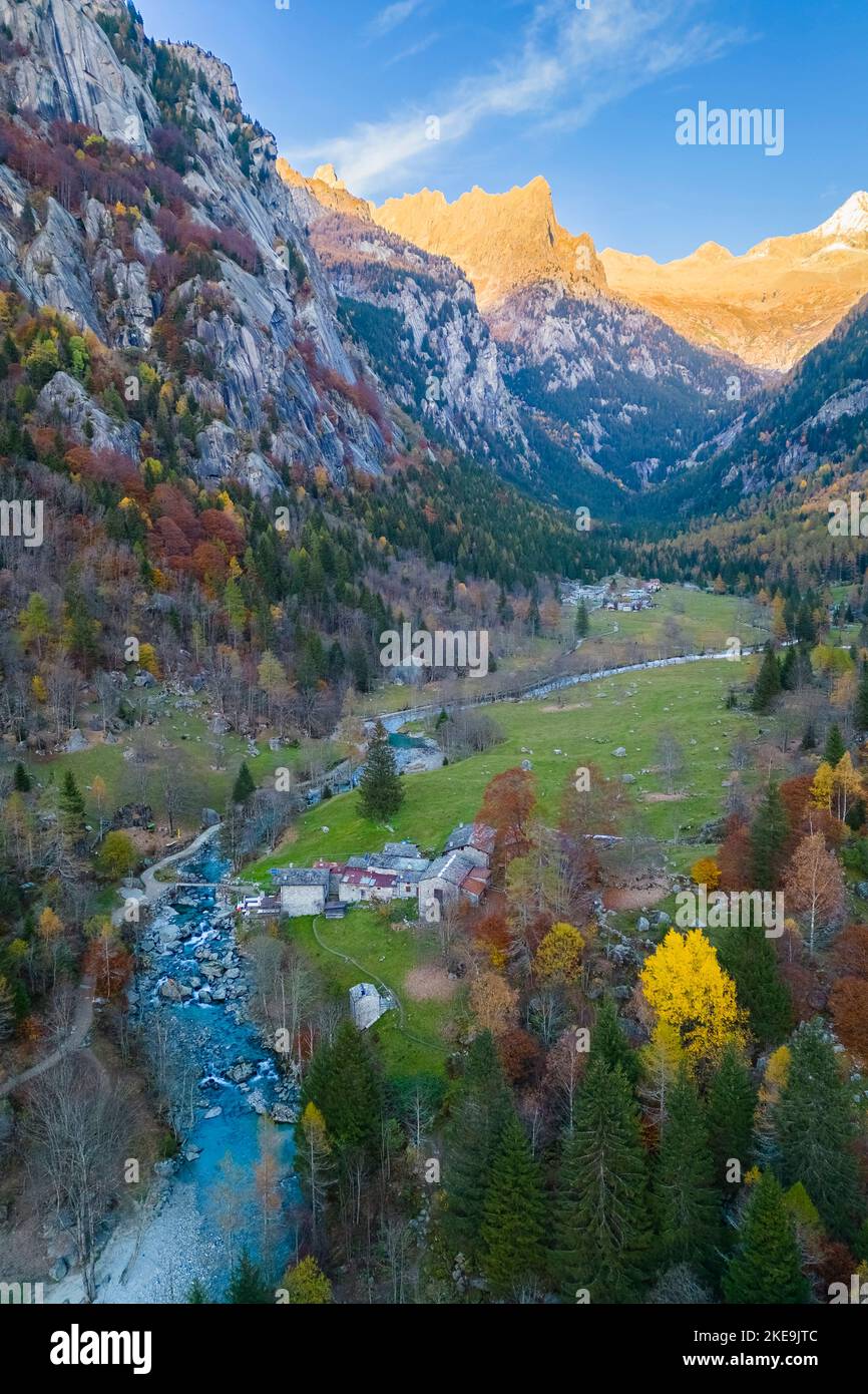 Aerial view of the Val di Mello river and valley at sunset in autumn ...