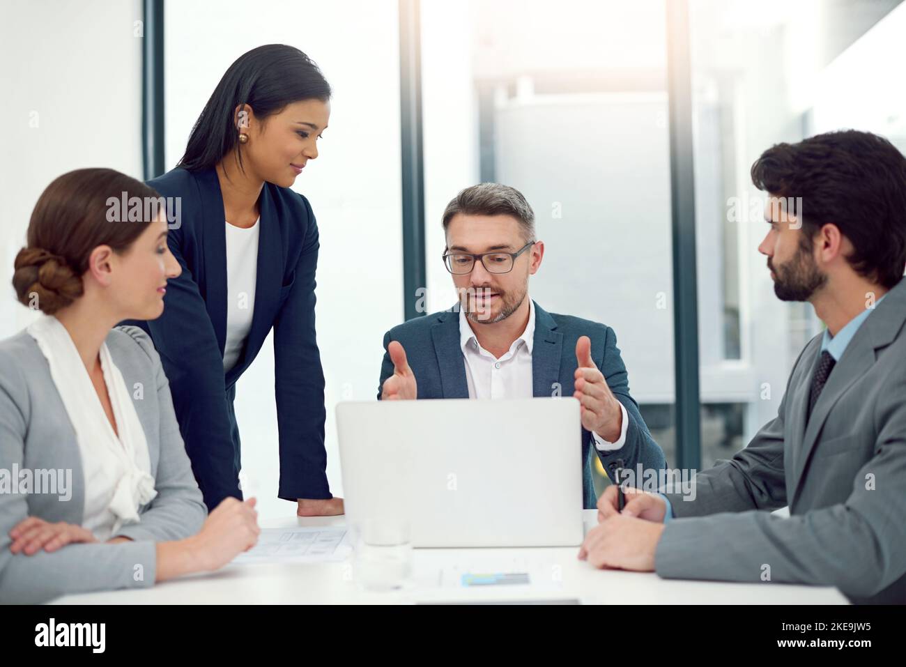 Getting down to business. a group of businesspeople having a meeting in ...