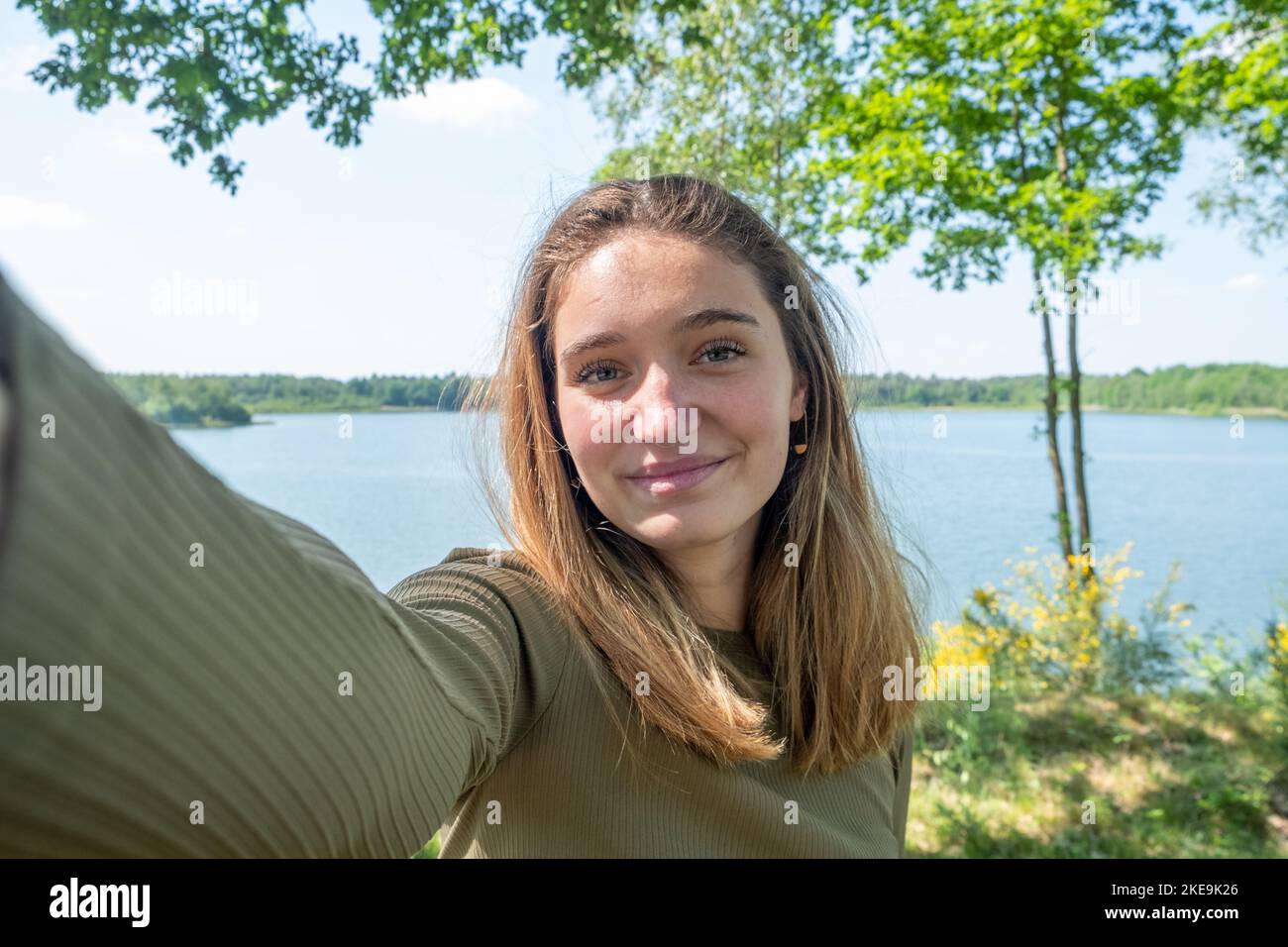 Beautiful Young Brunette Caucasian Woman Taking A Selfie With