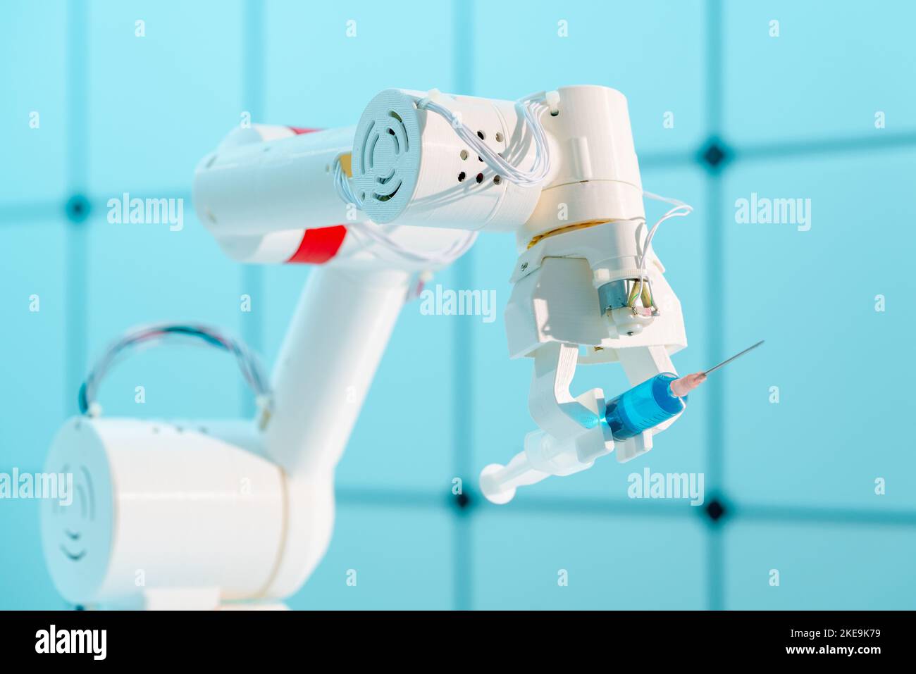 Robot hand with a medical syringe. Future medicine concept using robots ...