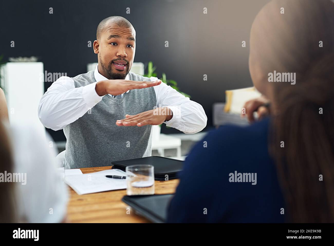 Man explaining something to a woman hi-res stock photography and images ...