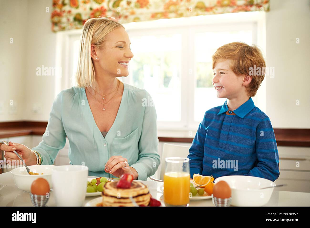 Sharing a nutritious and delicious breakfast together. a mother and son ...