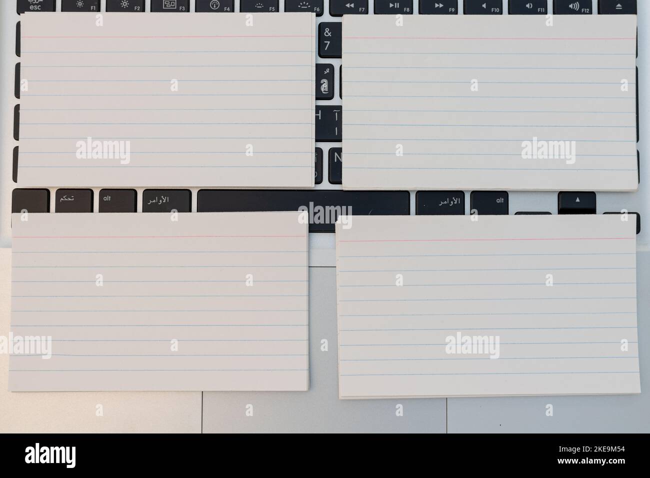 Blank business cards over laptop keyboard with copy space or blank ...