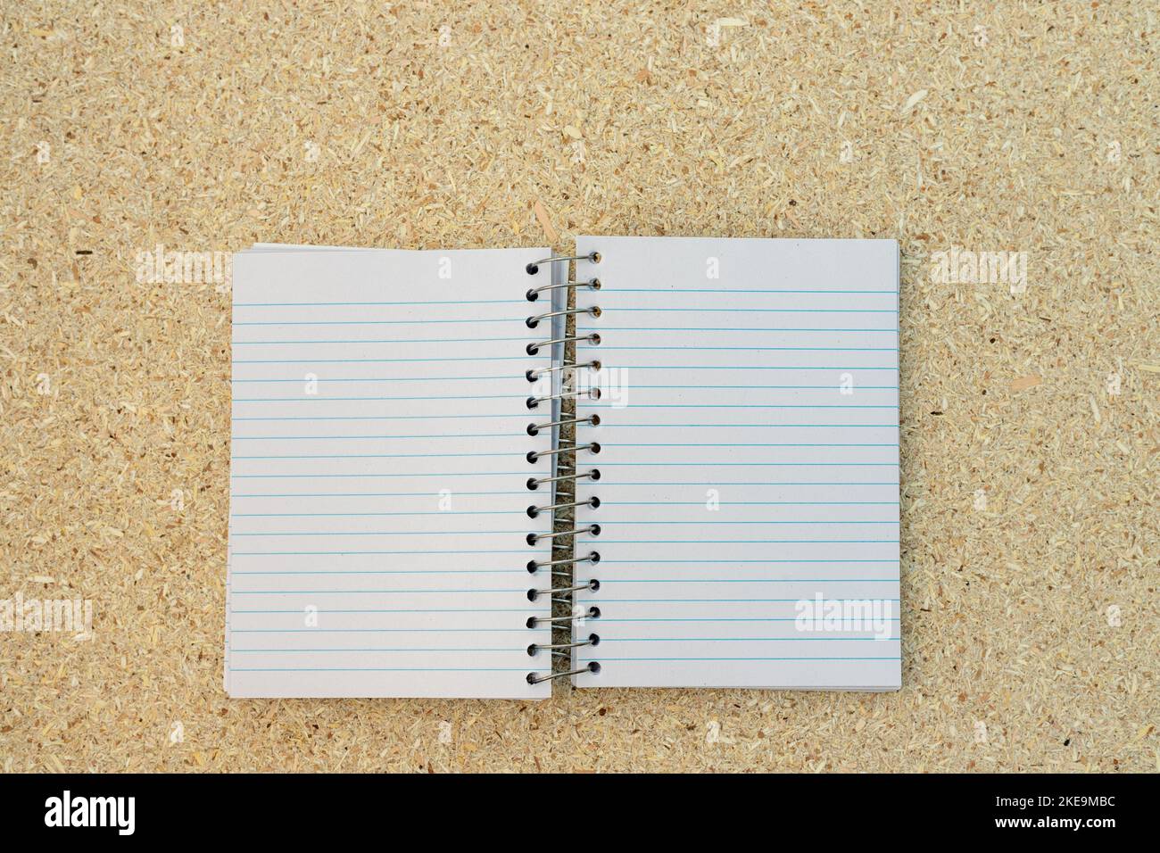 White blank spiral notebook over cork board background Stock Photo - Alamy
