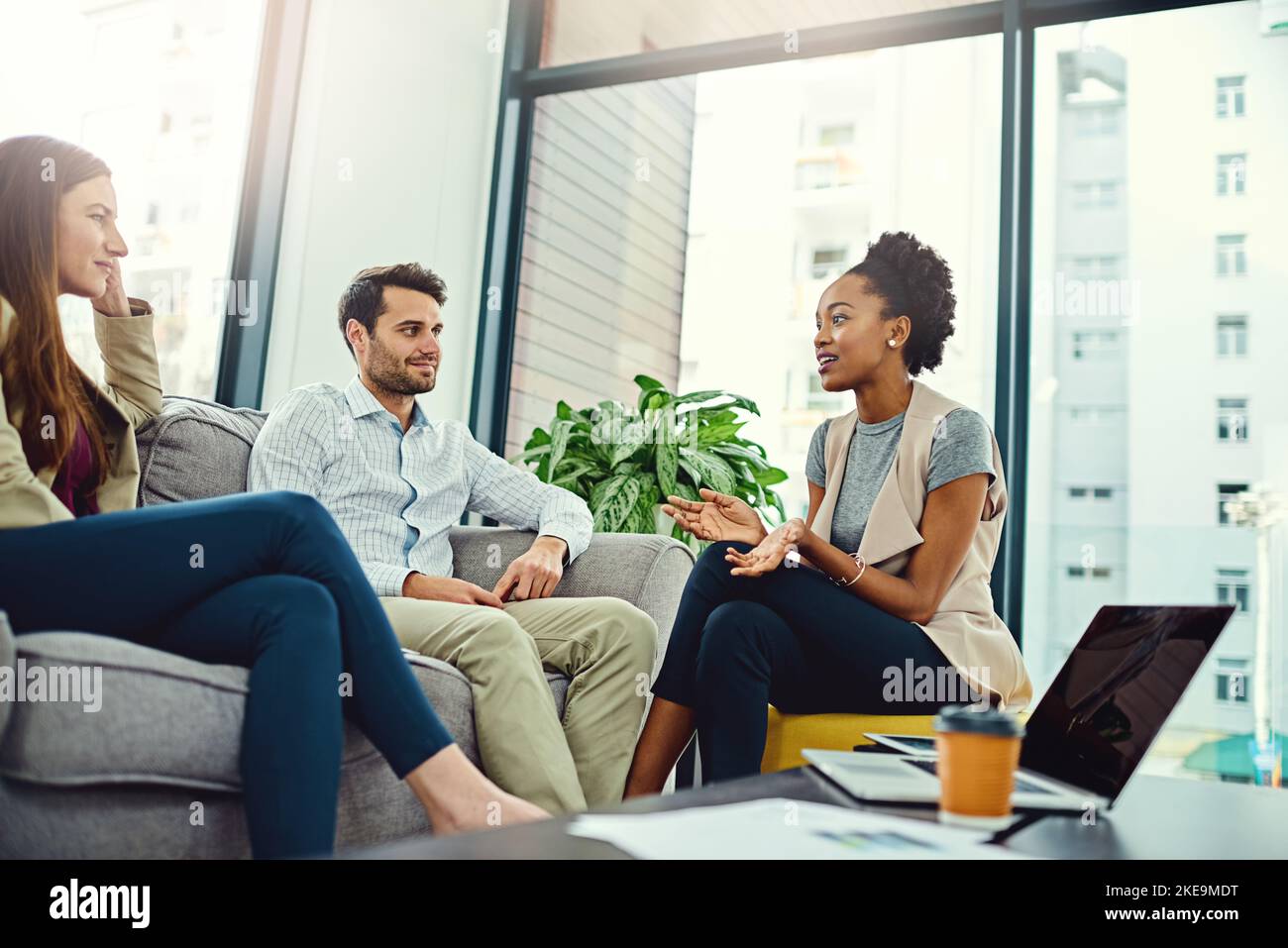 Paying close attention to their plans. a group of colleagues having a ...