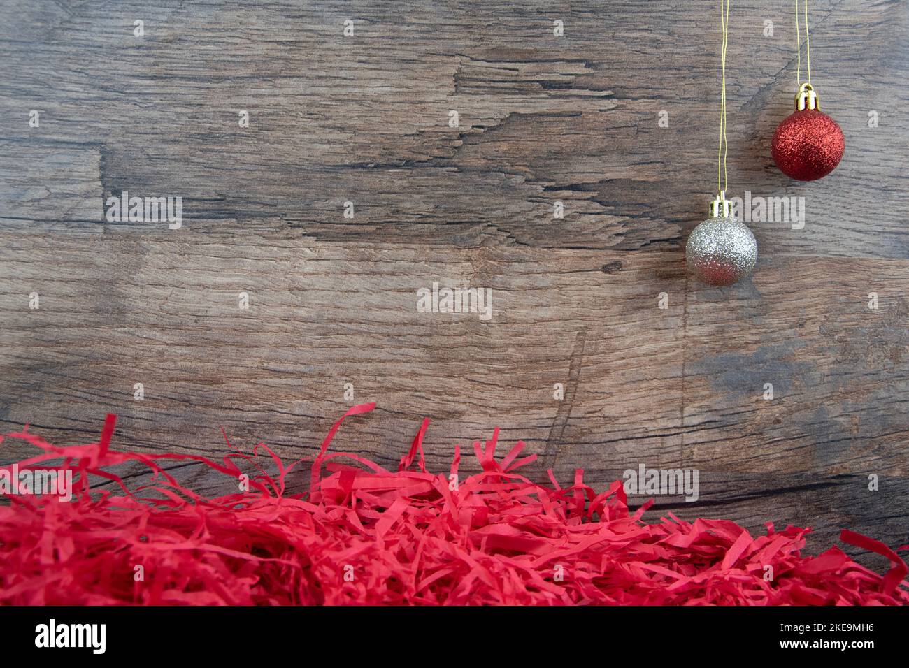 Silver and red Christmas baubles on rustic wooden background Stock ...