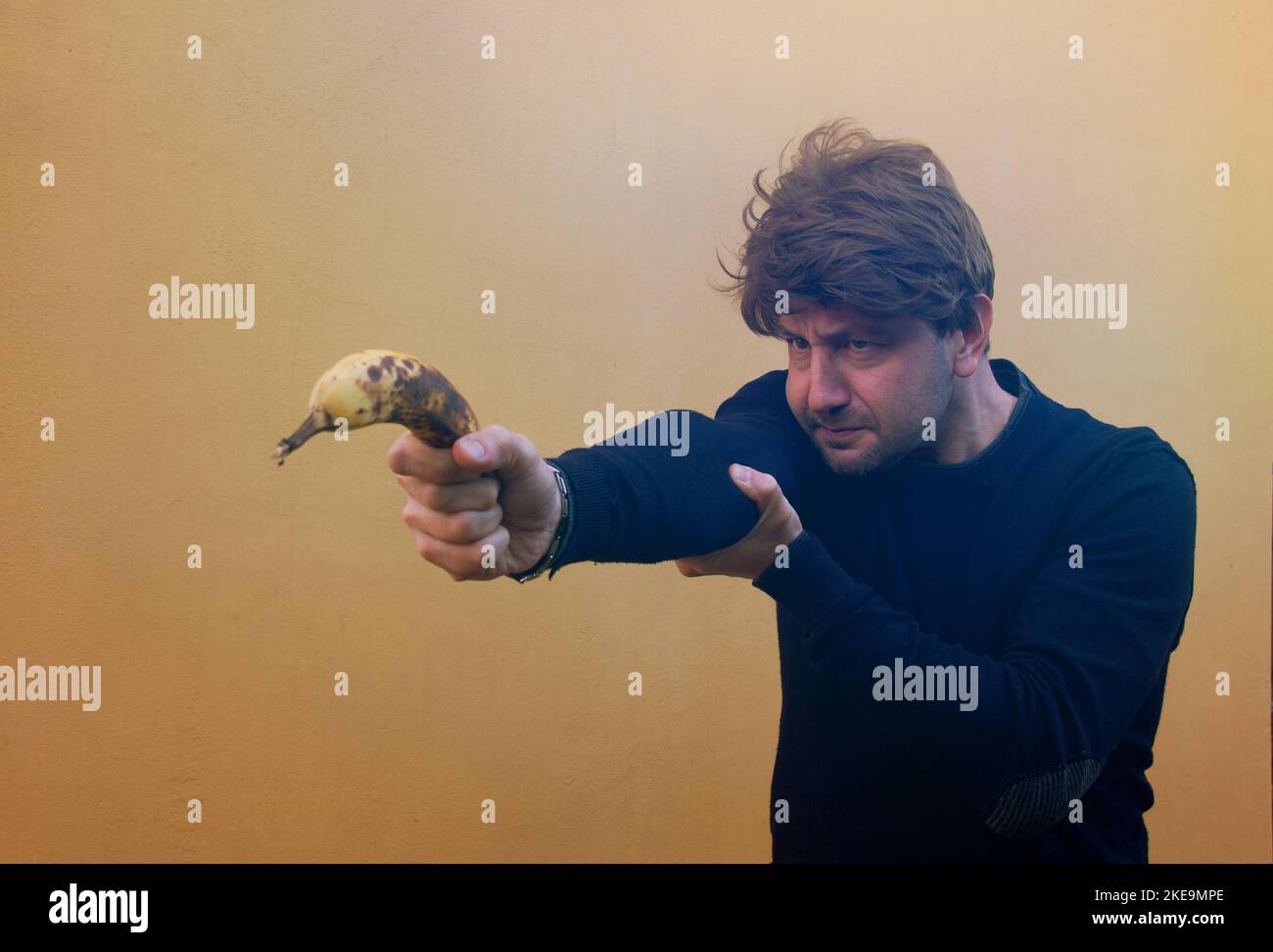 Funny young man hand gun hi-res stock photography and images - Alamy