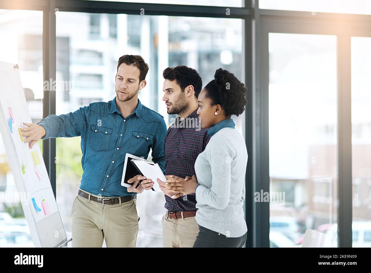 Creating opportunities together. colleagues having a discussion using a ...