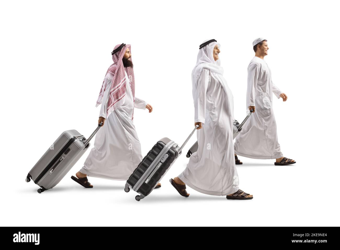 Men in ethnic arab clothes walking and pulling suitcases isolated on ...