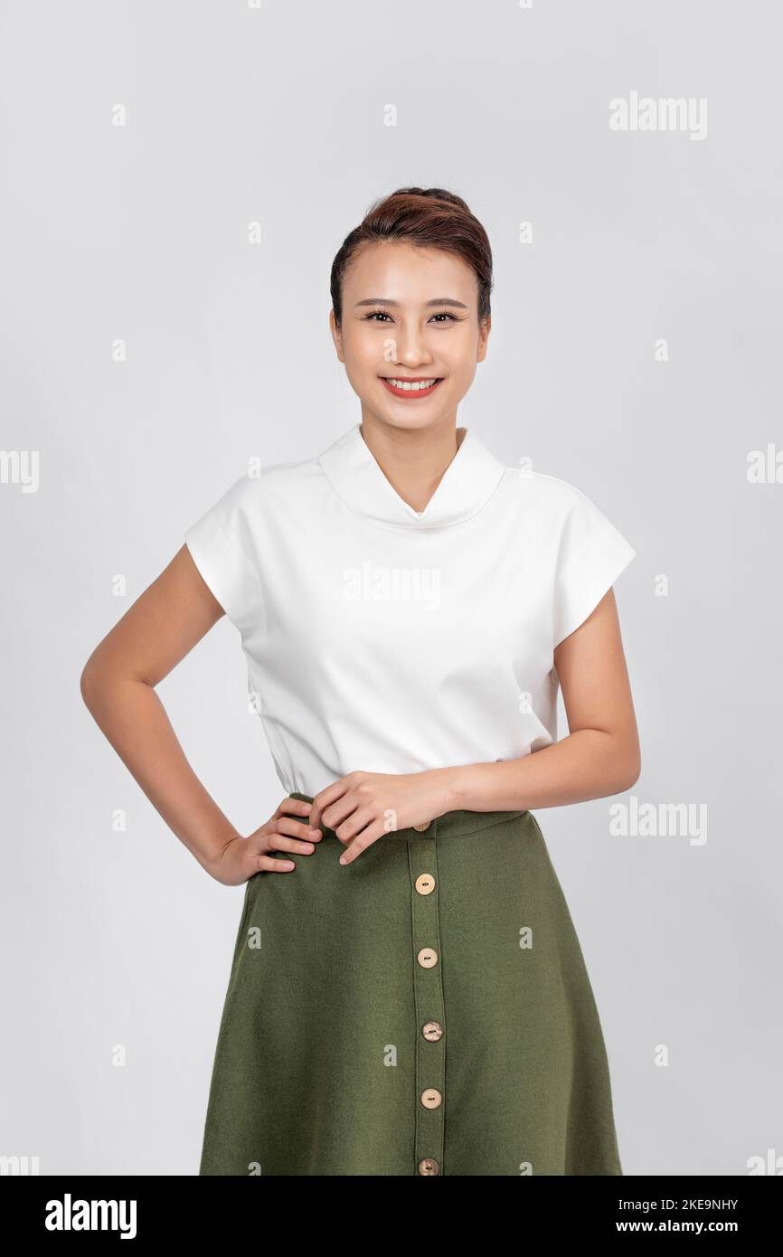 Happy carefree woman with joyful expression, smiling while standing in ...