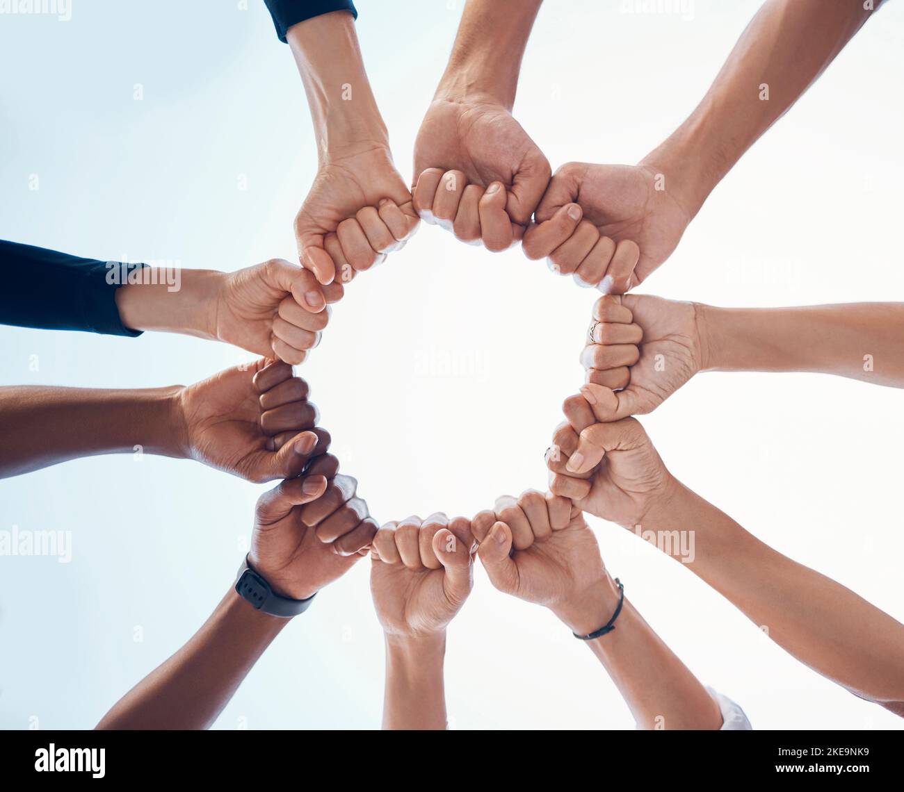 Hands, trust and support fist circle with low angle for loyalty ...