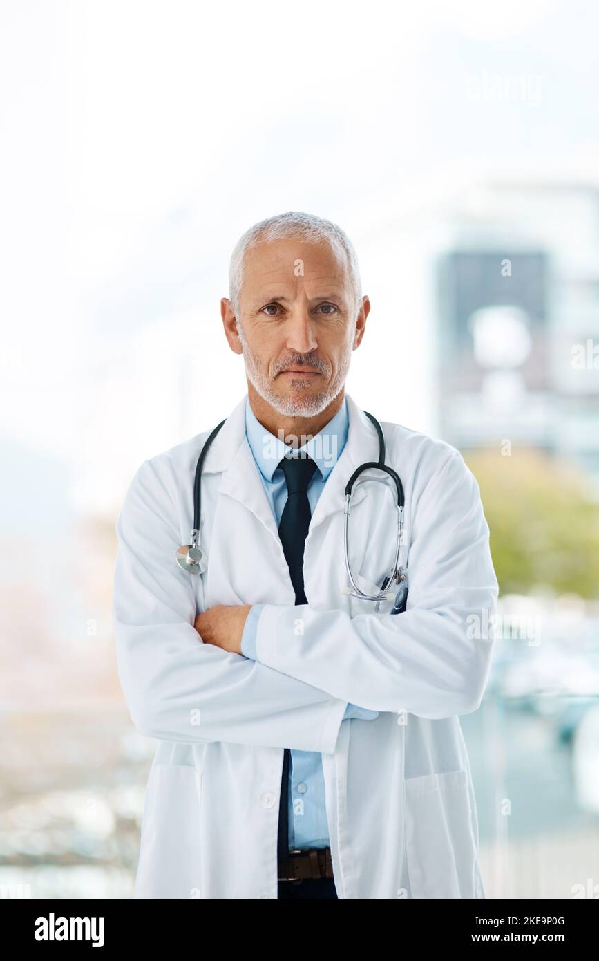 You seriously need a doctor more like me. a mature male doctor standing ...