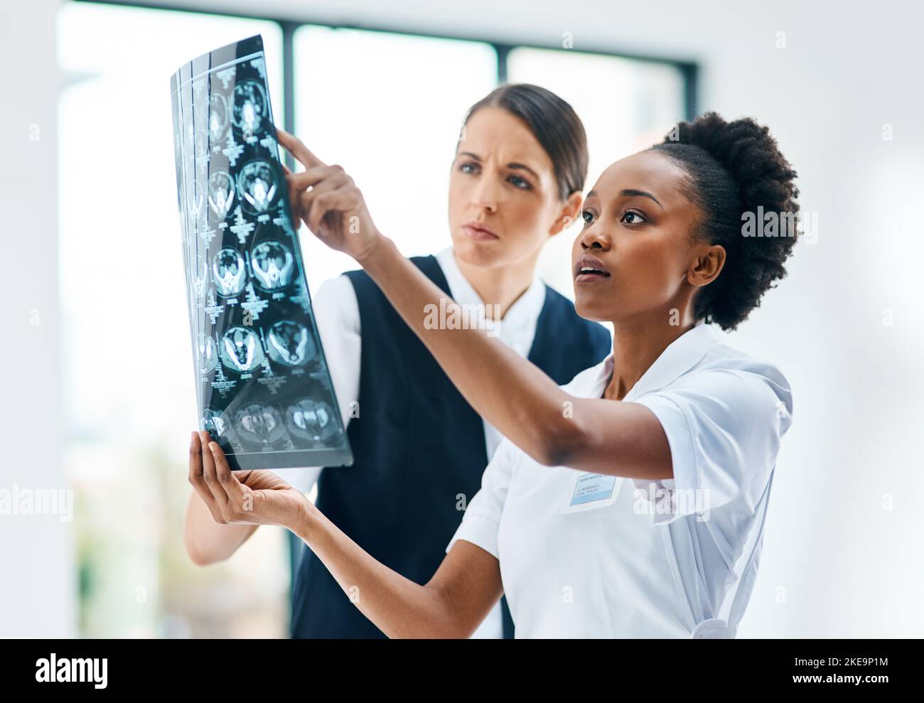 Were ready to make a diagnosis. medical practitioners looking at a ...