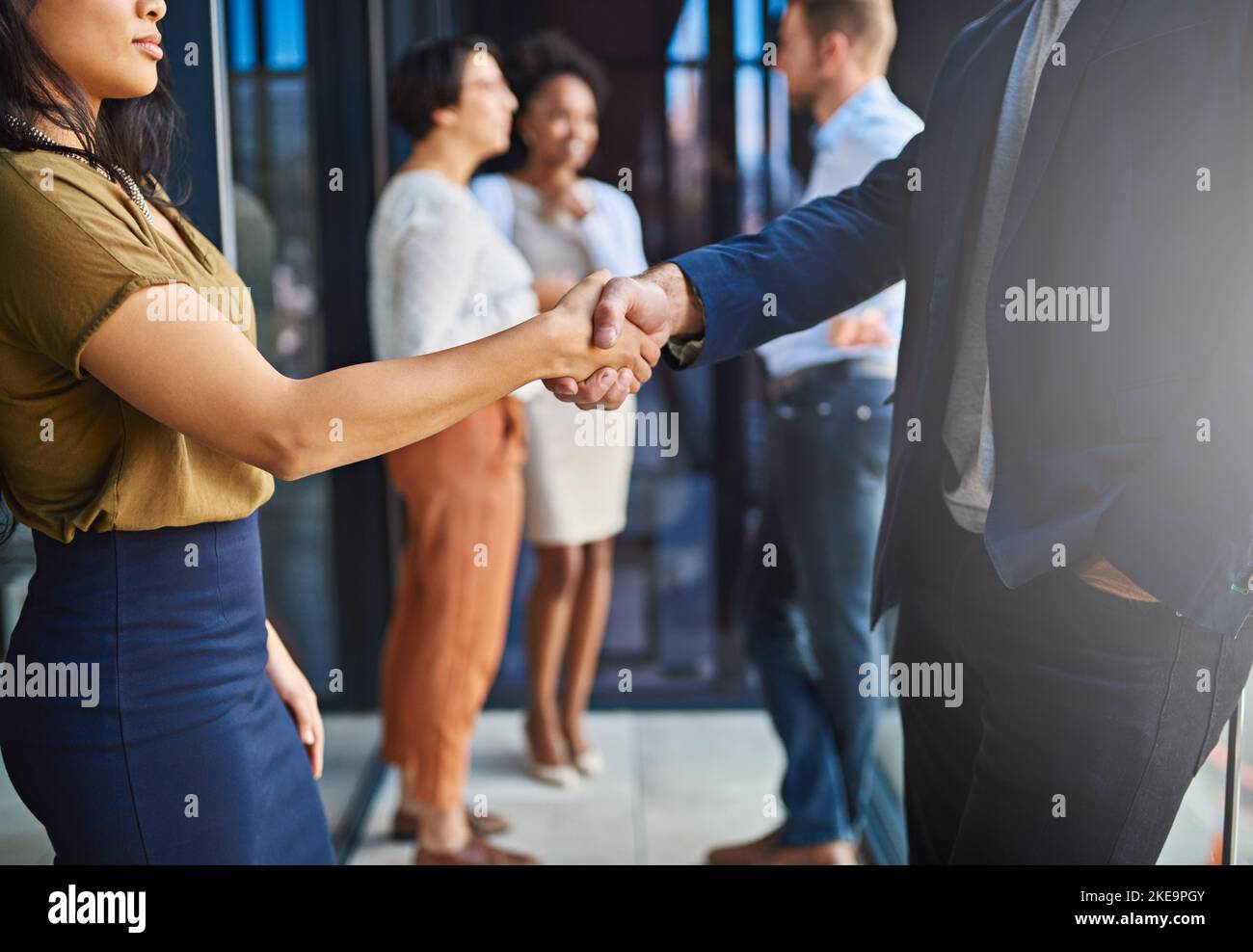 Heading towards success. two unidentifiable businesspeople shaking ...