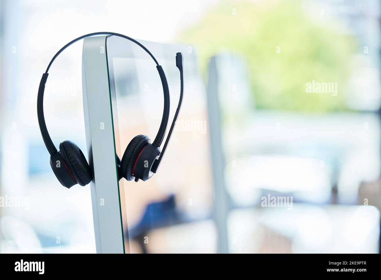 Call center, headset and computer with office background, consulting ...