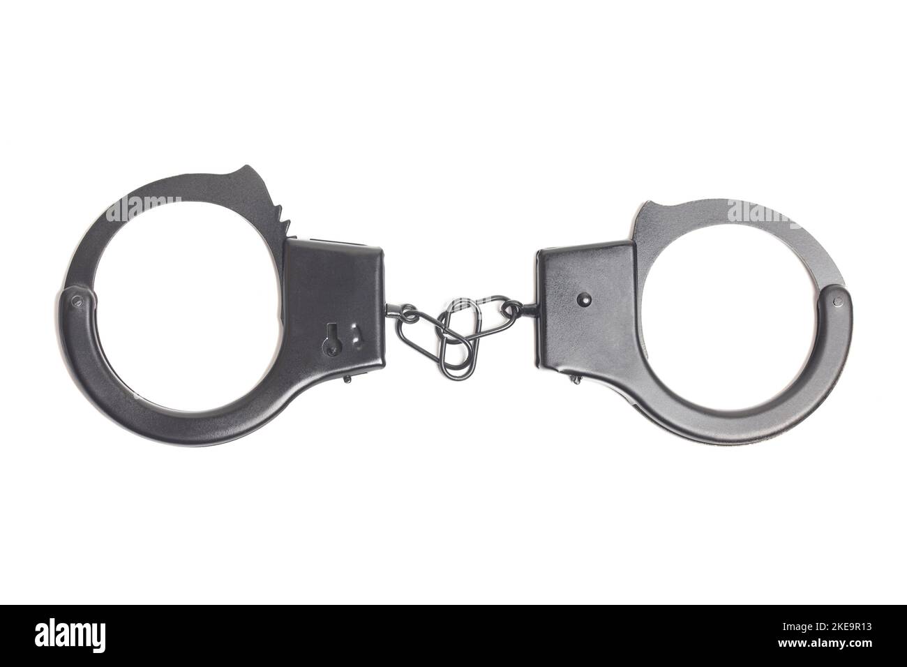 Handcuffs isolated on white background Stock Photo - Alamy
