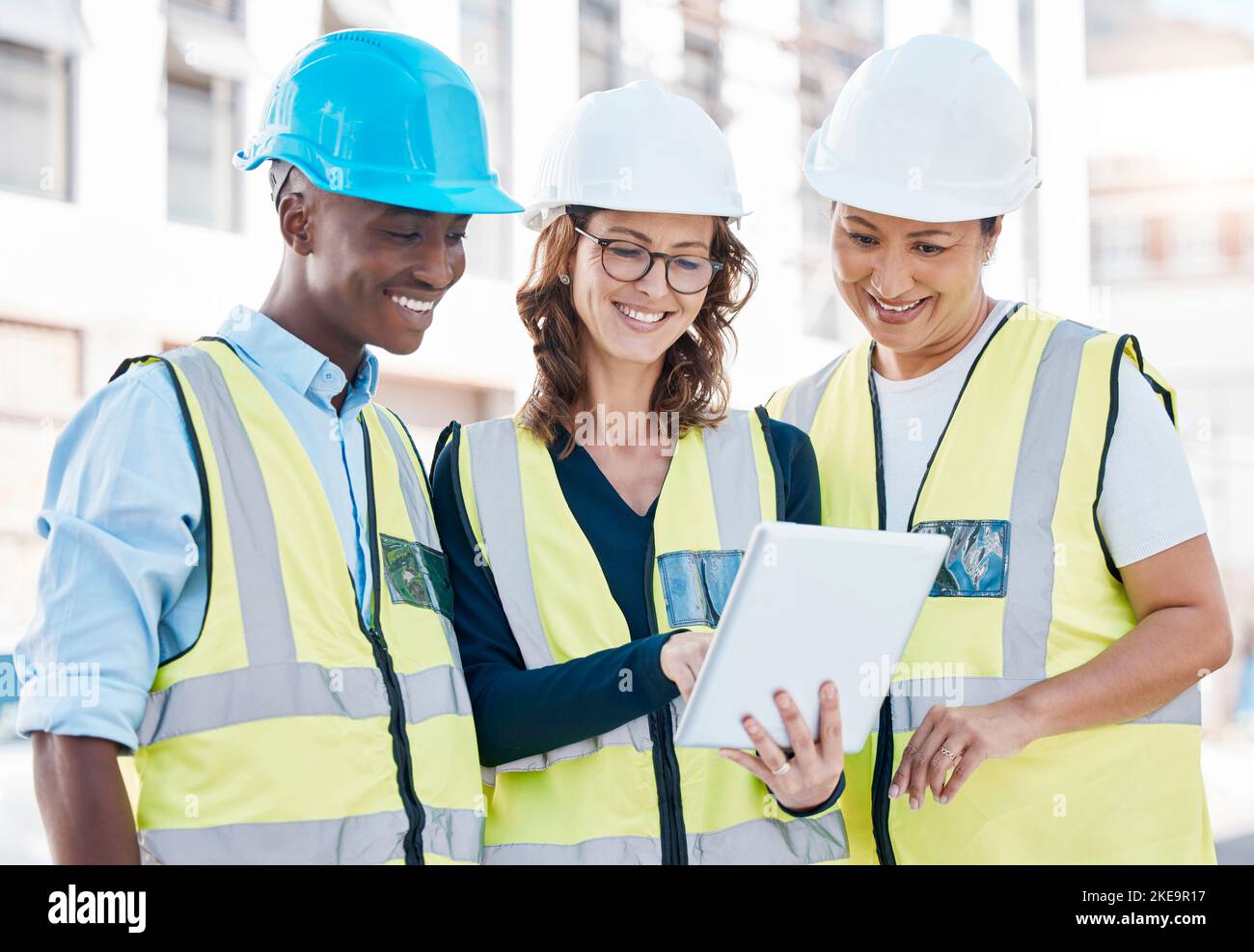 Architect, team and tablet in city construction for building inspection ...