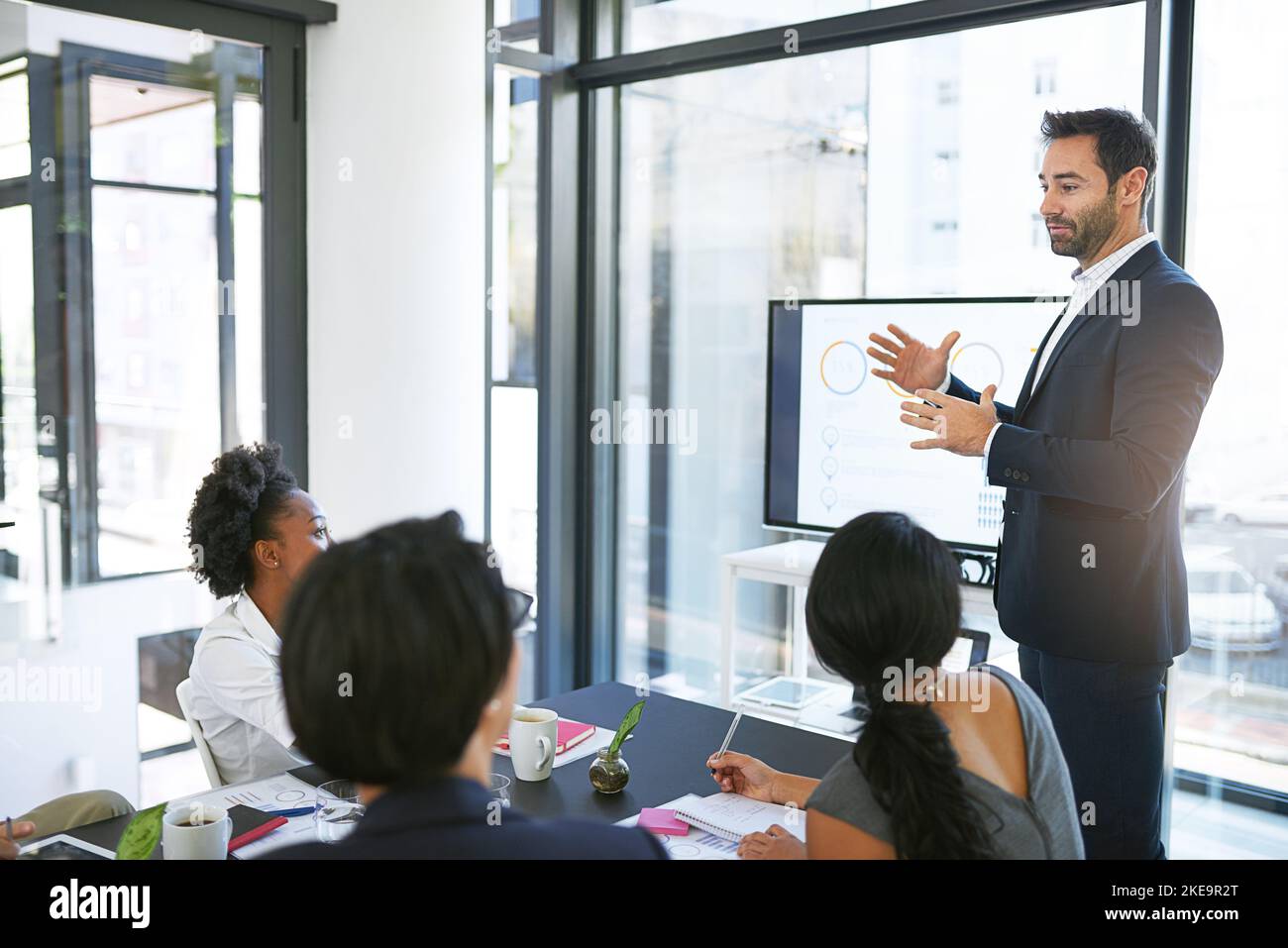 Giving the perfect presentation. a businessman giving a presentation in ...