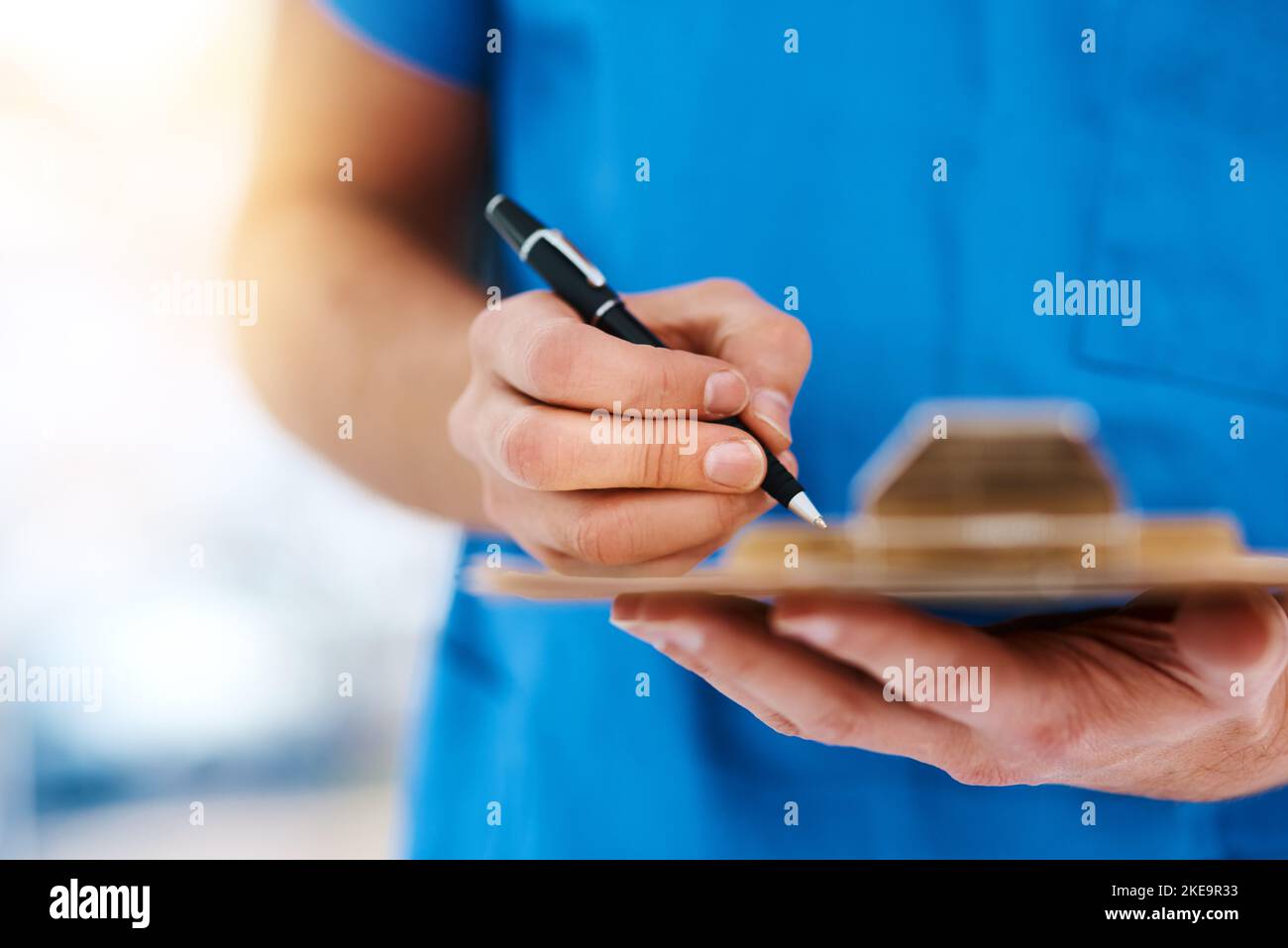 Ill have to put that on record. a male nurse writing something on a ... Ill have to put that on record. a male nurse writing something on a ...