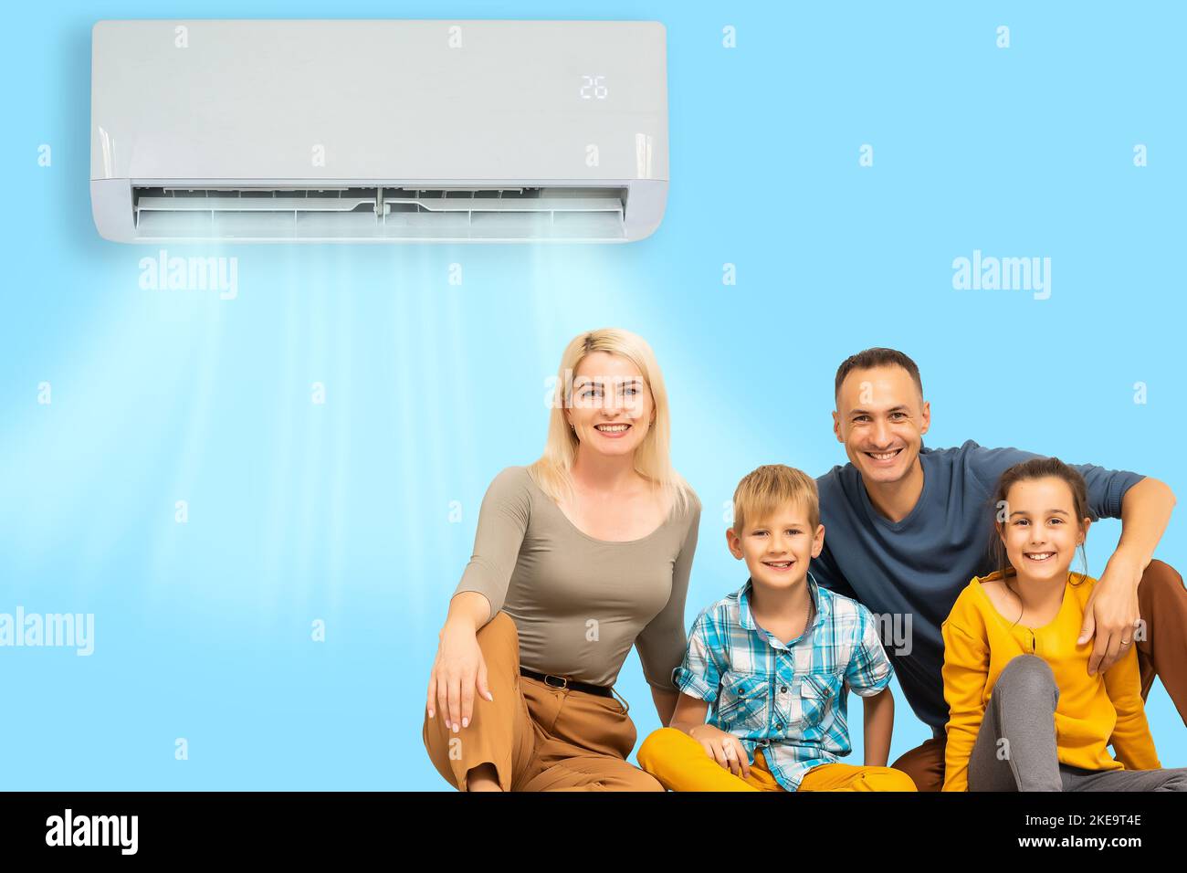 Happy Family Under Air Conditioning Stock Photo - Alamy
