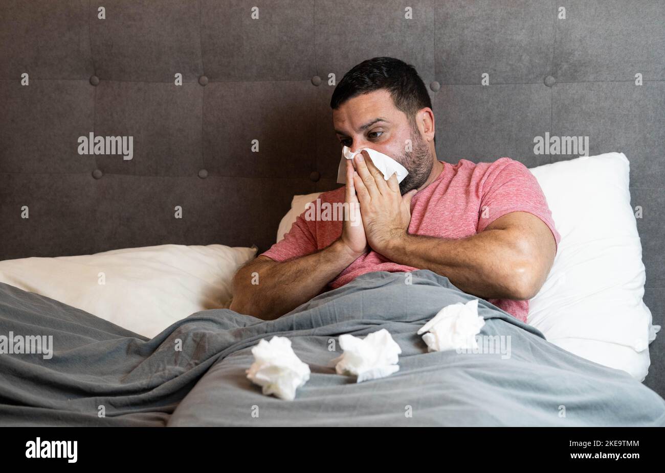 man in bed sick with coronavirus drinking a cup of tea Stock Photo - Alamy