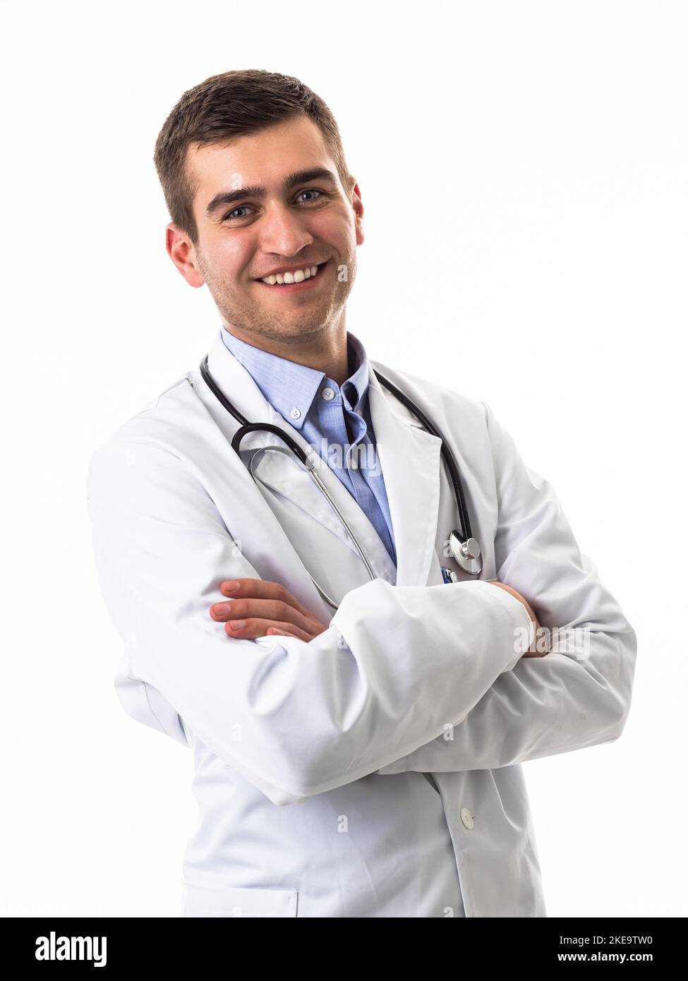 Confident male doctor in white lab coat and stethoscope standing with ...