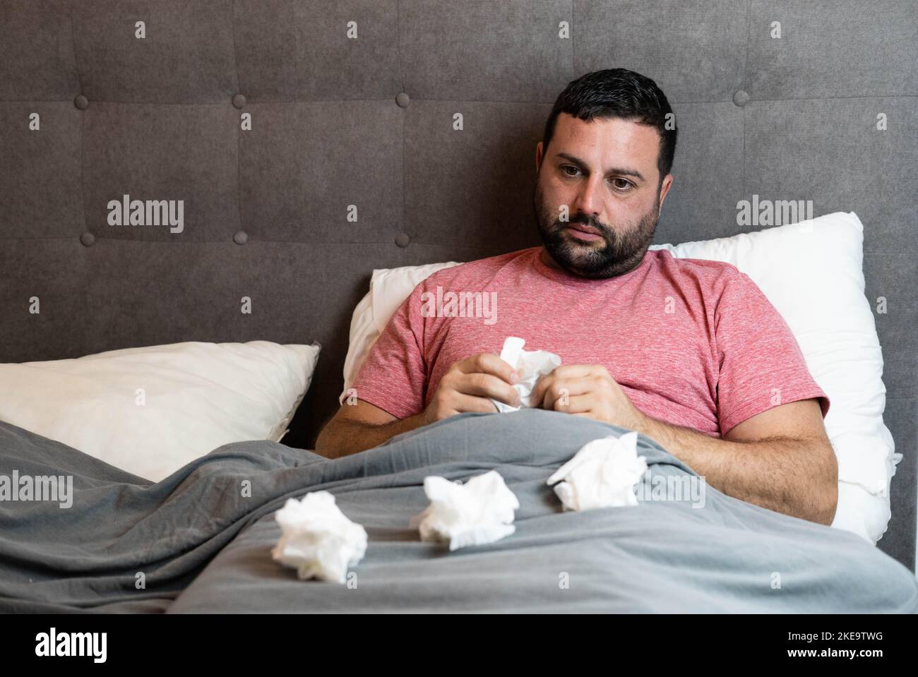 man in bed sick with coronavirus drinking a cup of tea Stock Photo - Alamy
