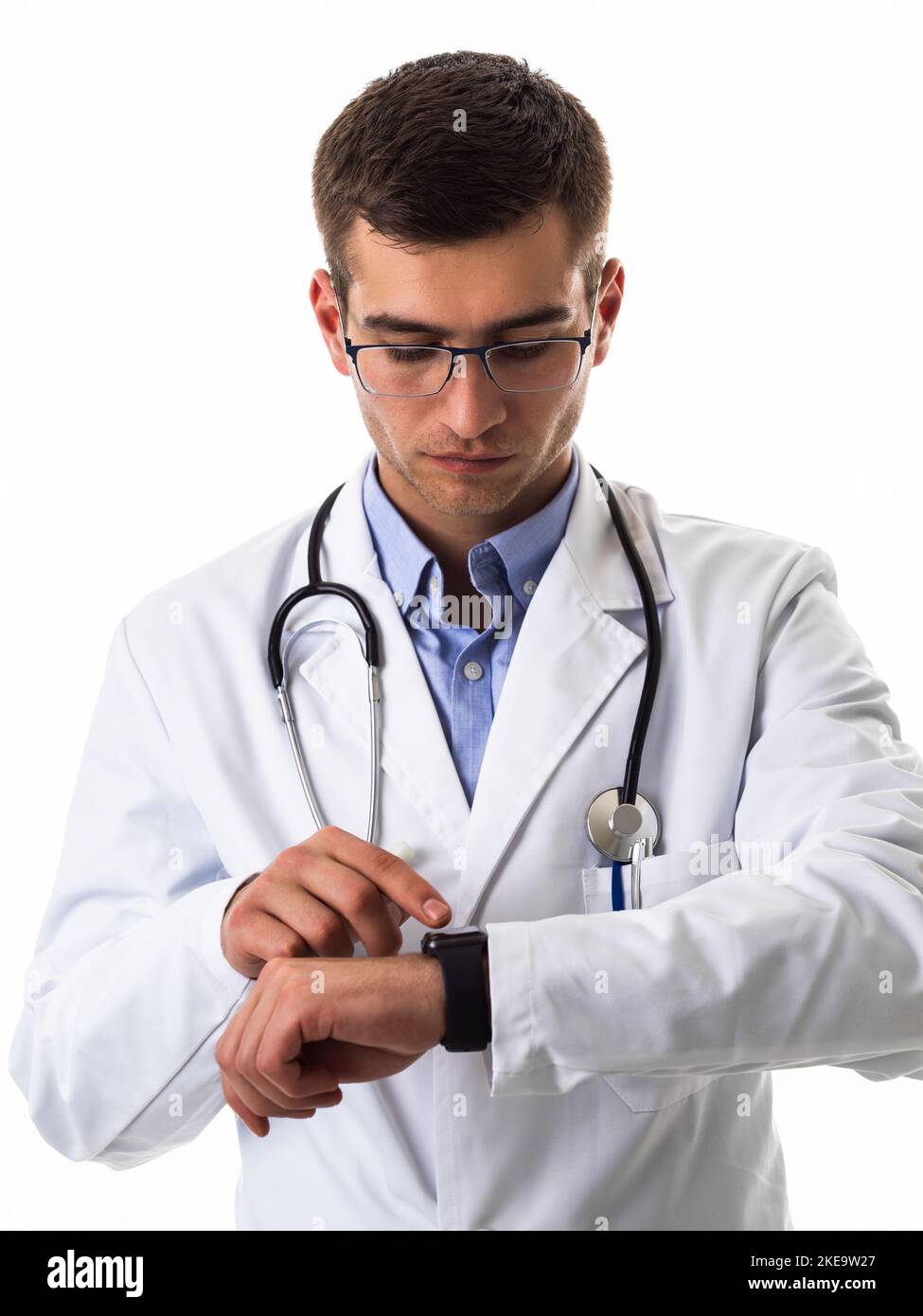 Doctor in suit with stethoscope using smart watch while isolated on ...