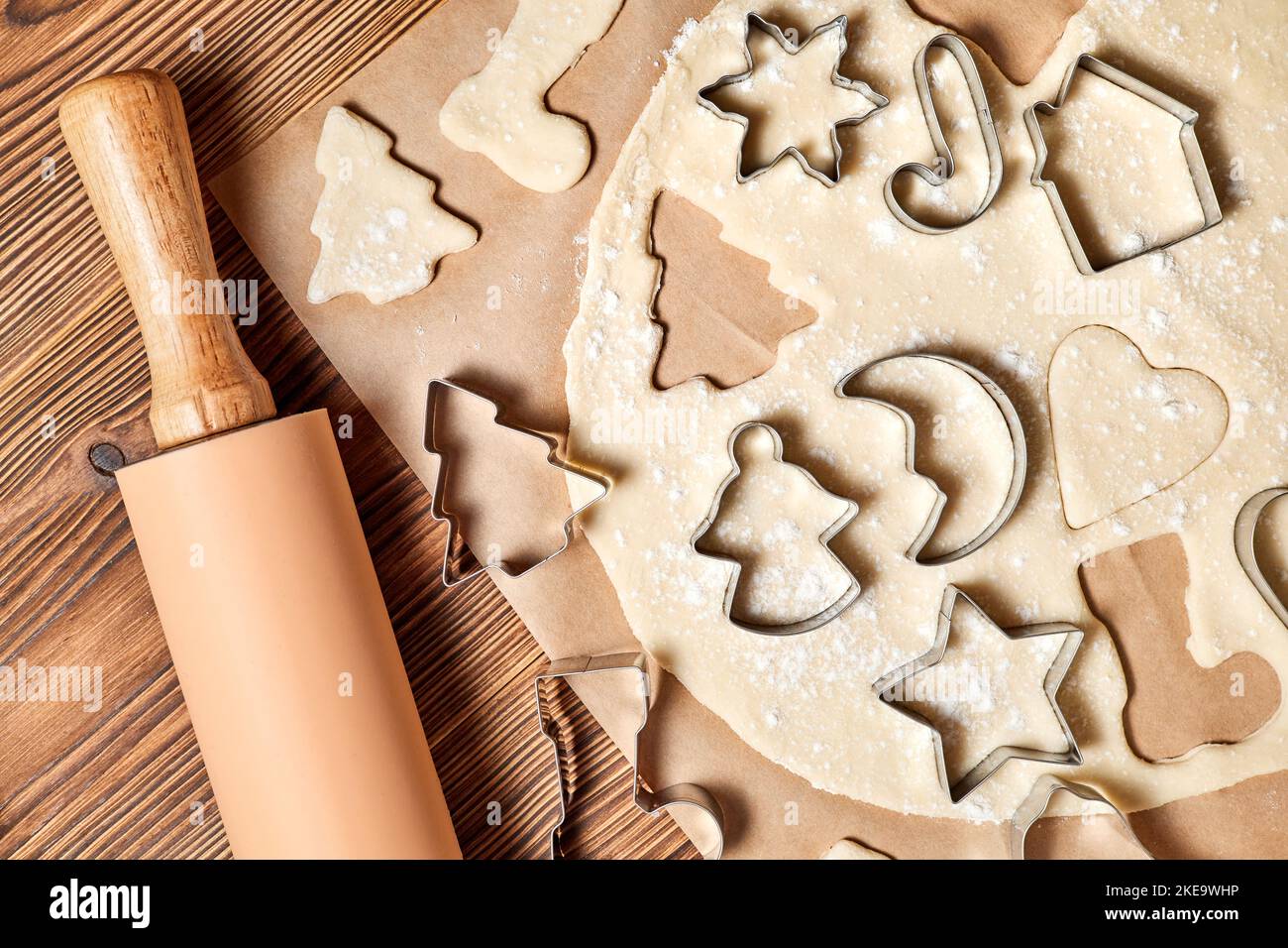 Making gingerbread Christmas Cookies Using form for cooking on wooden ...