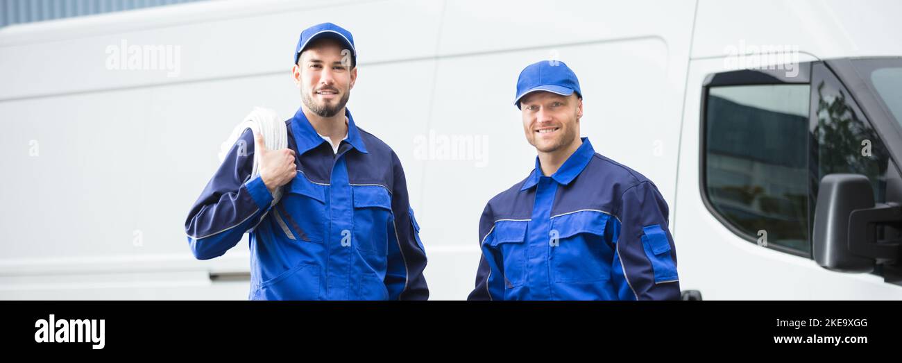 Happy Plumber or Handyman Technician Near Van Car Stock Photo - Alamy