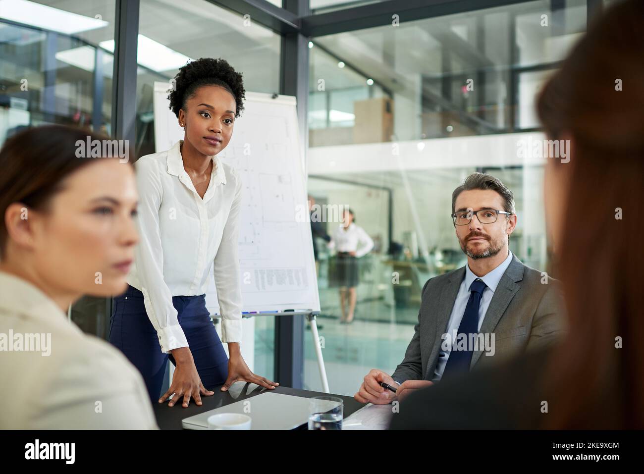 Working on a plan of action together. a group of business colleagues ...