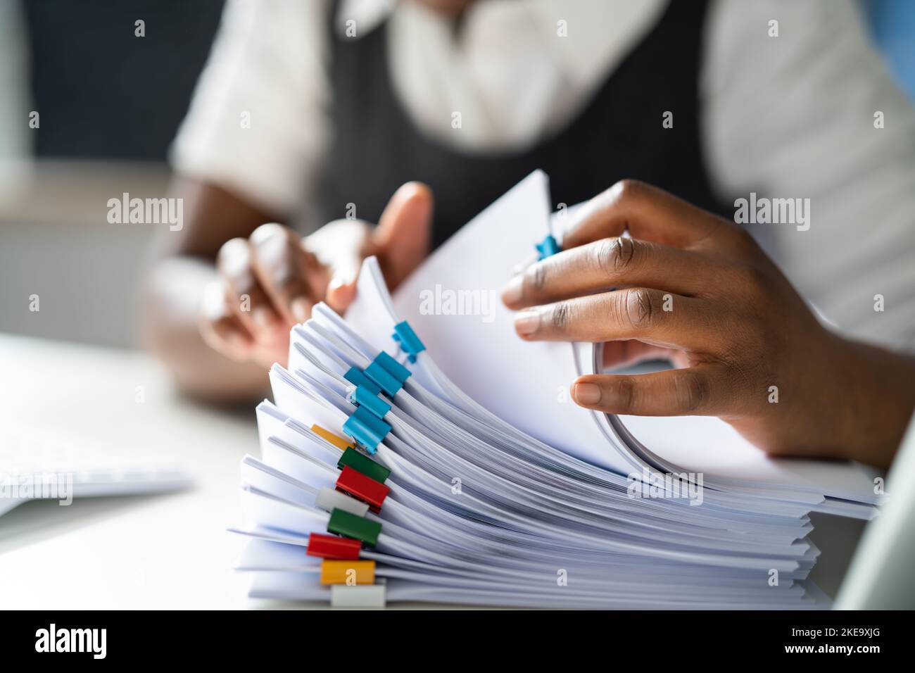 Clerk With Stacked Tax Files And Accounts Documents Stock Photo - Alamy