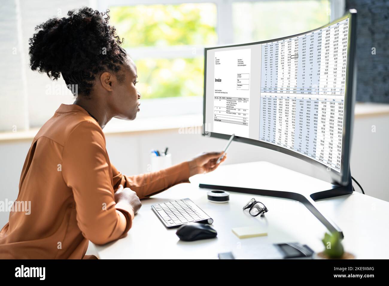 Medical Codes And Accounts Manager In Office With Bill Stock Photo - Alamy
