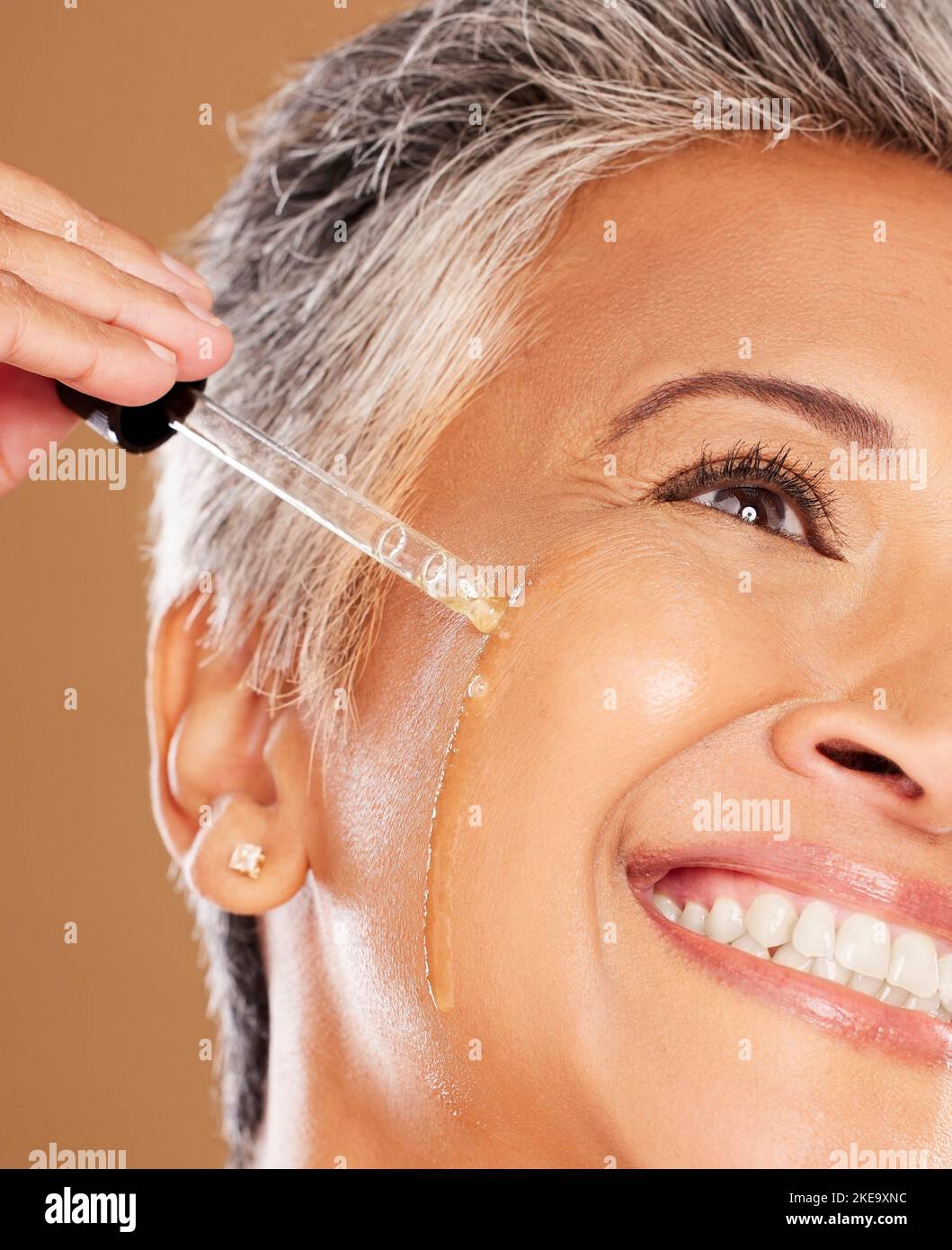 Elderly woman skincare serum hi-res stock photography and images - Alamy