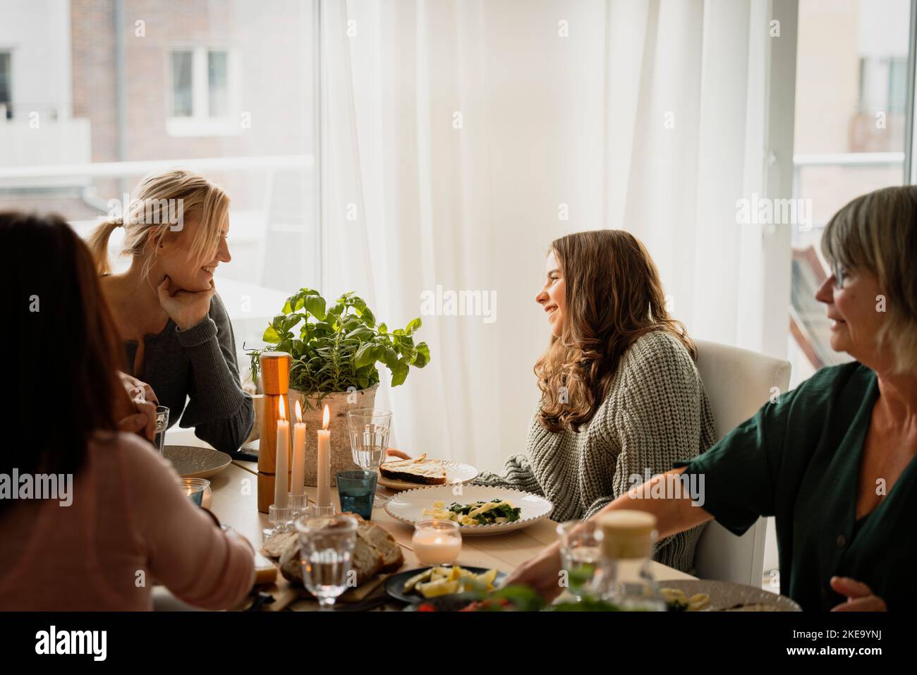 Family eating dinner at home Stock Photo - Alamy
