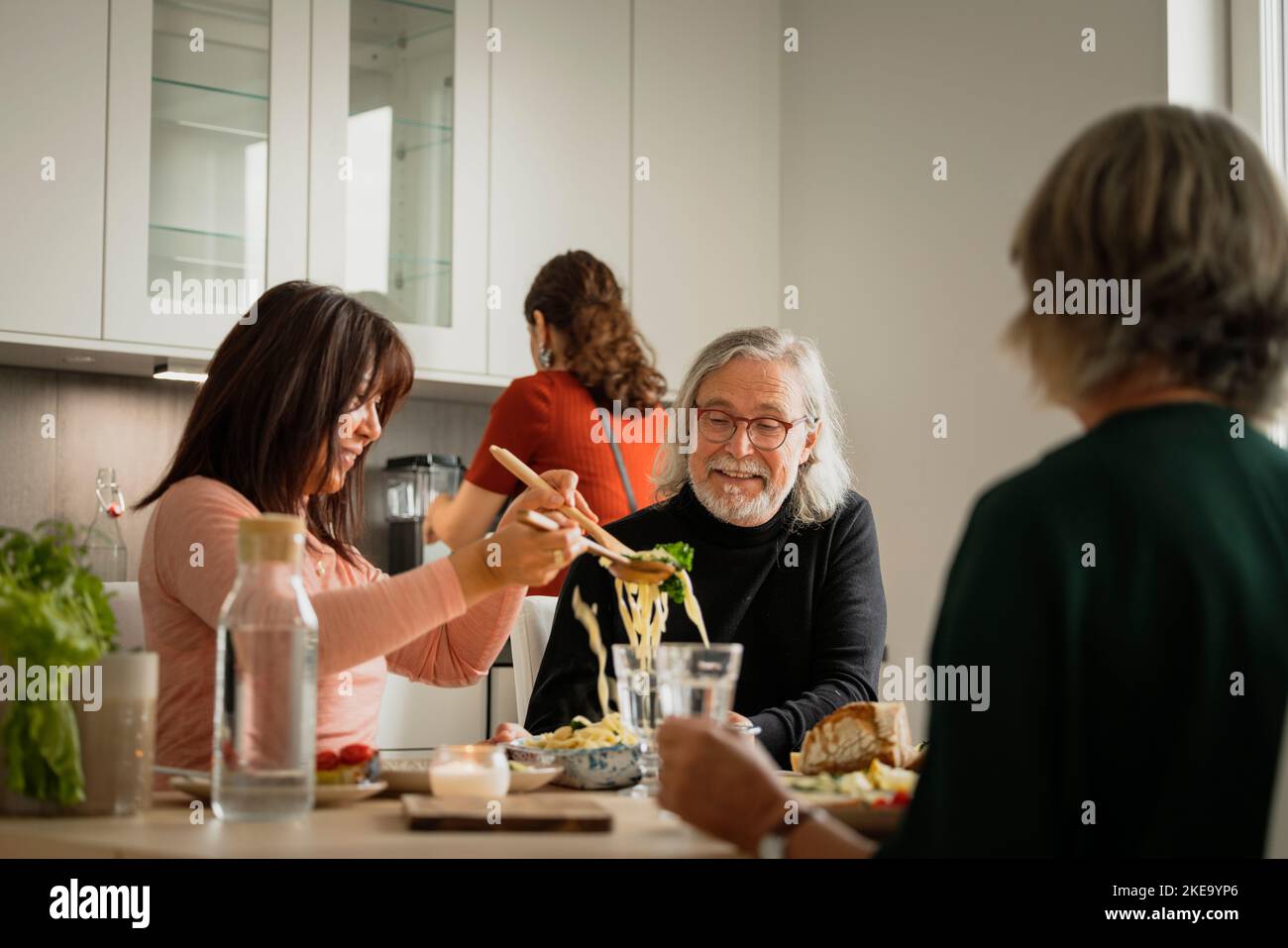 Family eating dinner at home Stock Photo - Alamy