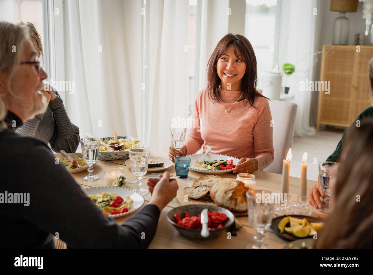 Family eating dinner at home Stock Photo - Alamy