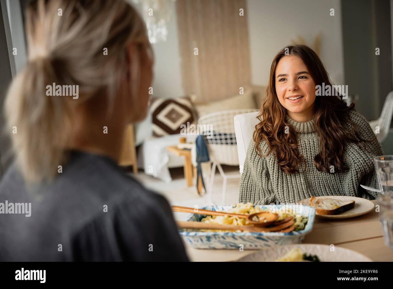 Family eating dinner at home Stock Photo - Alamy