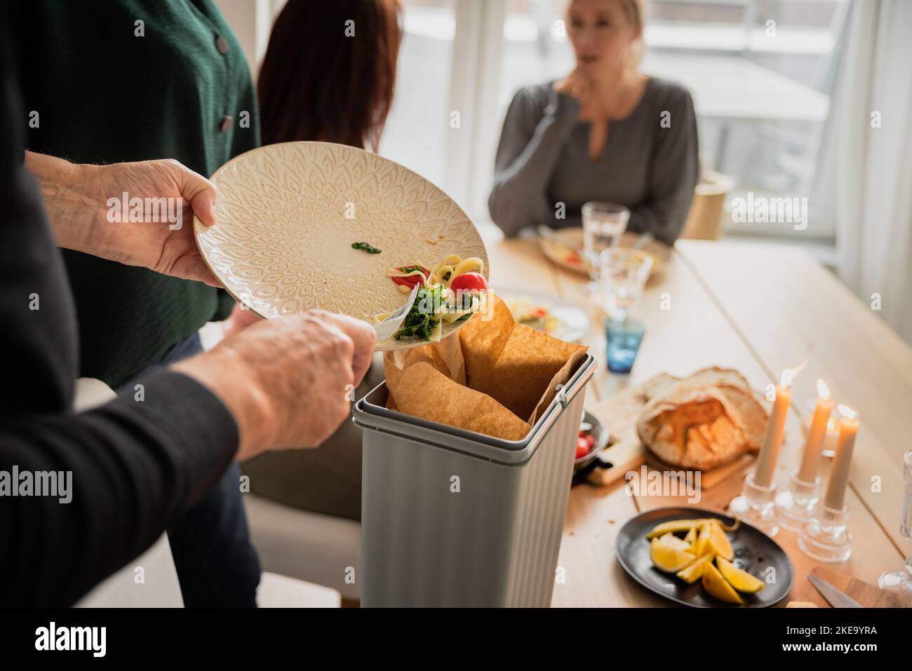 Family cleaning after having dinner Stock Photo - Alamy