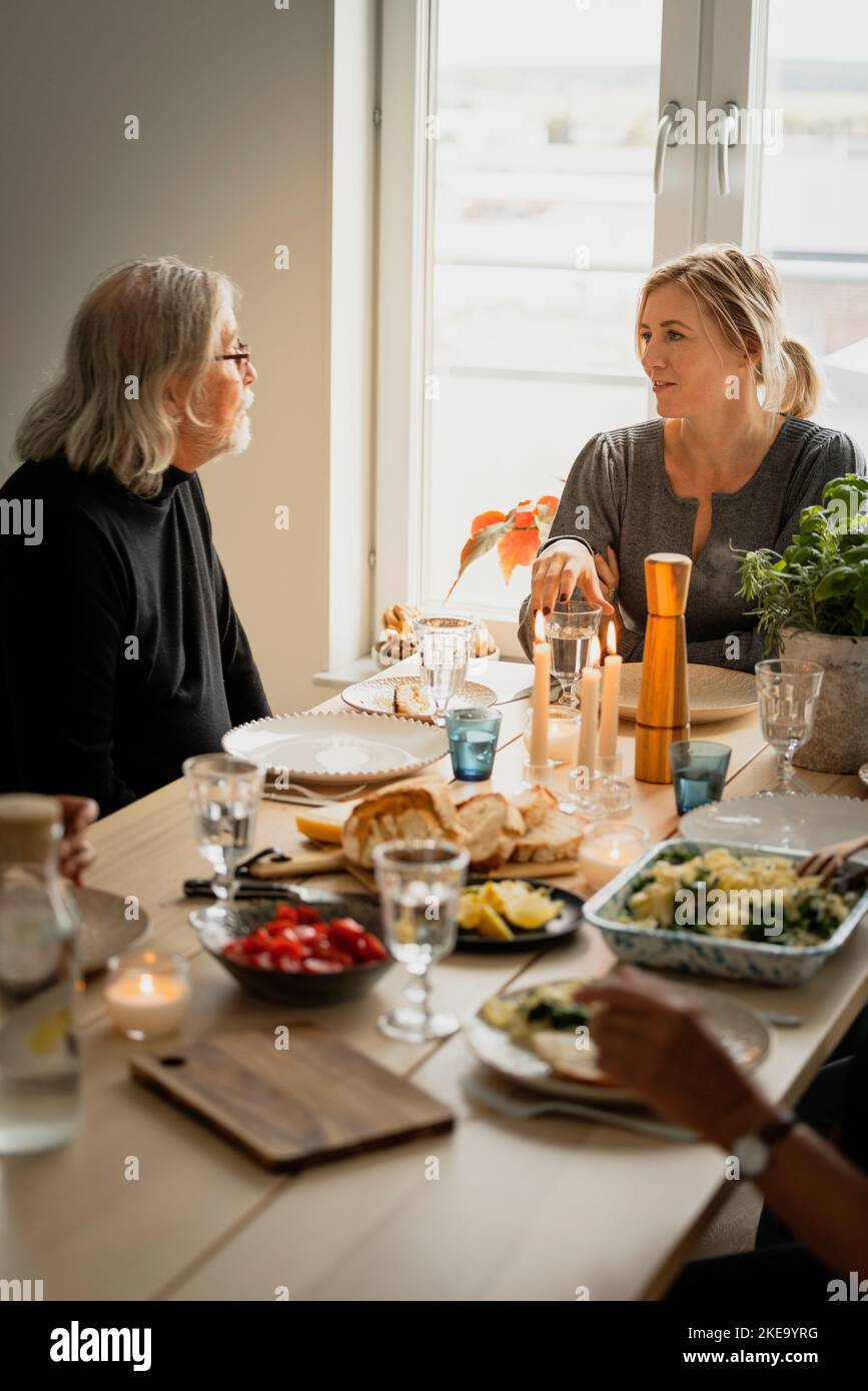 Family eating dinner at home Stock Photo - Alamy